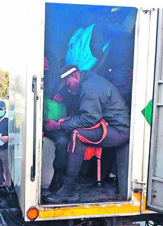 Guards crammed in back of truck! | Daily Sun