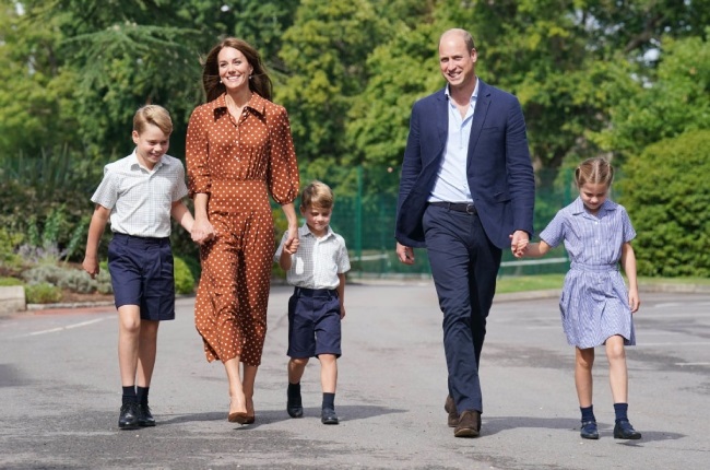 Football-mad Prince William and Prince George spotted cheering on their ...