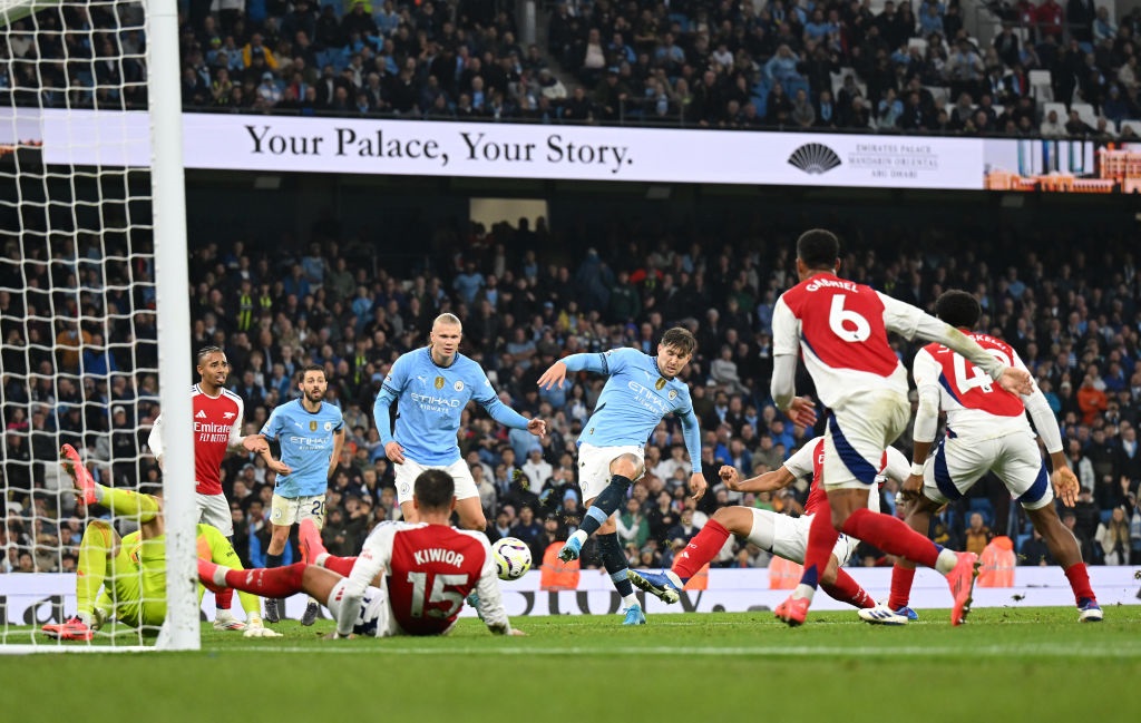 Stones strike late for Man City to draw against 10-man Arsenal in epic ...