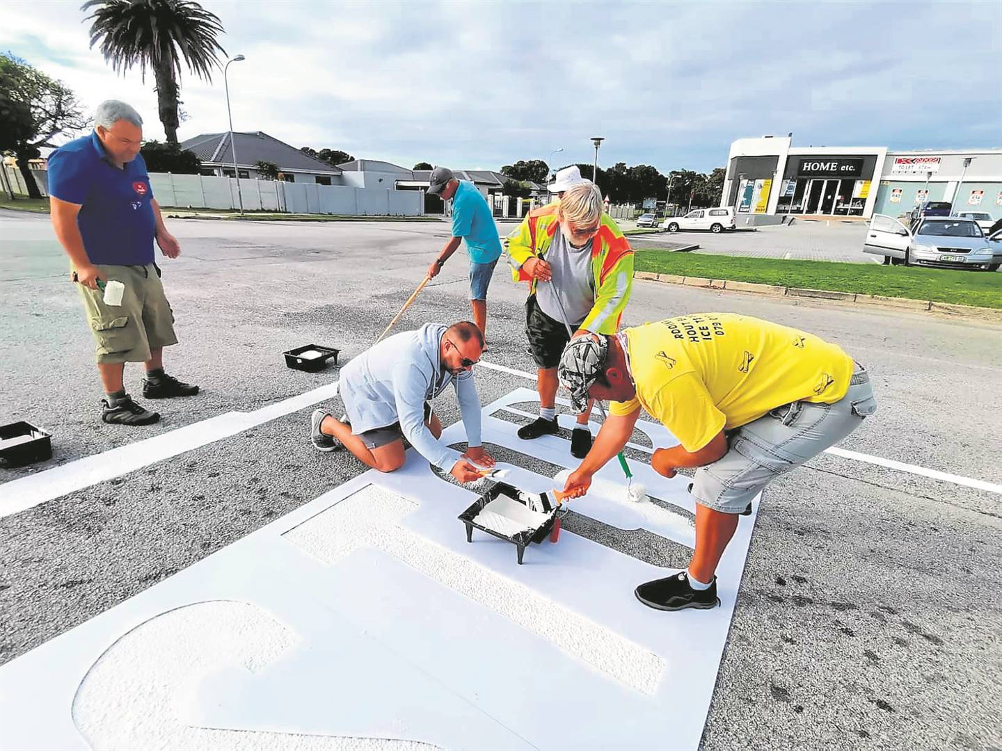 Residents come together to repaint street markings | News24
