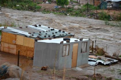 Floods are swallowing our shacks! | Daily Sun