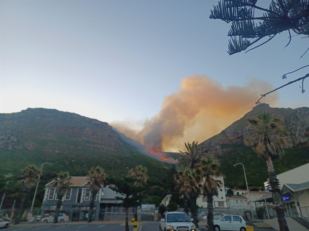 WATCH | Mountain blaze in Muizenberg contained, fire crews remain at ...