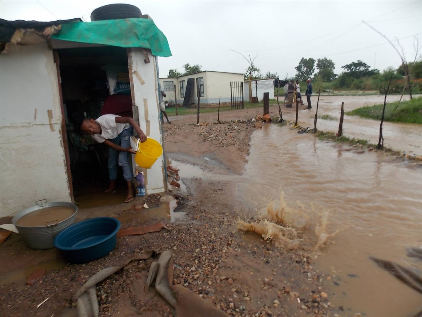 Pics: Stuck in pool of rain water! | Daily Sun